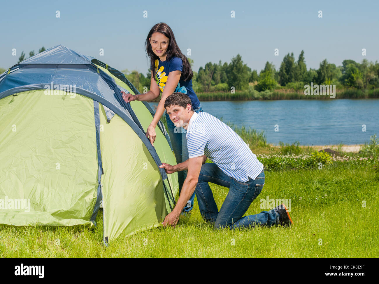 Couple Setting Up Tent Stock Photo - Alamy