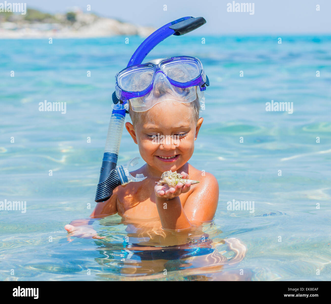 Boy With Seashells High Resolution Stock Photography and Images - Alamy