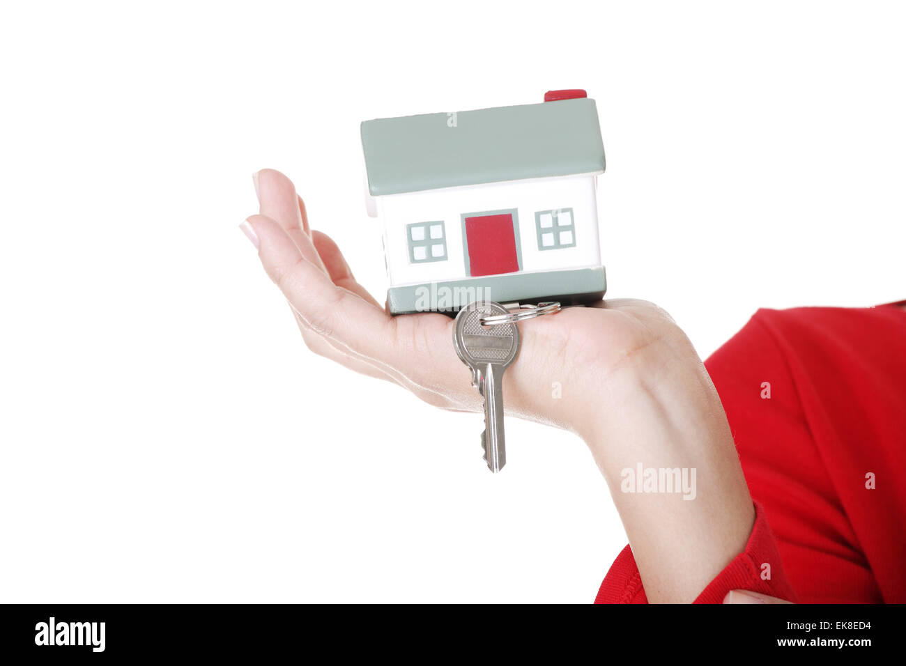 Hand holding a house key Stock Photo - Alamy