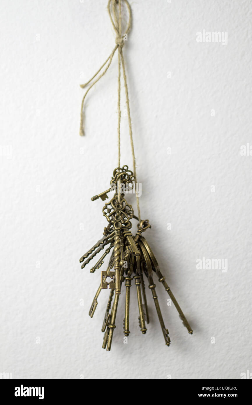bunch of keys hanging on the white wall Stock Photo - Alamy