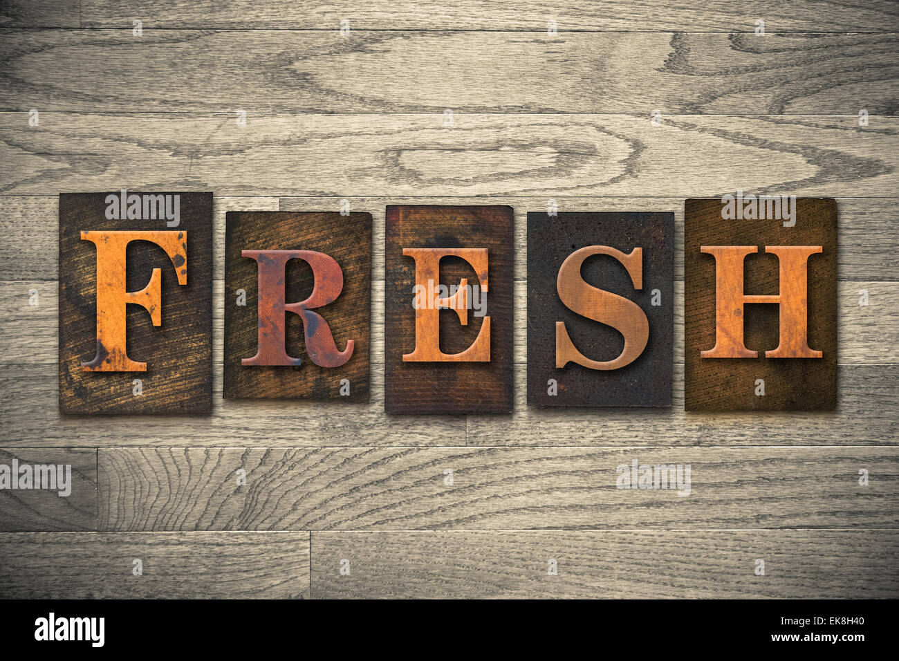 The word "FRESH" theme written in vintage, ink stained, wooden ...