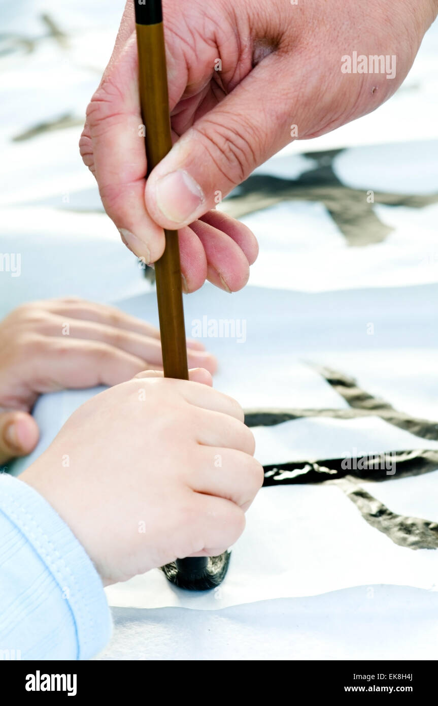 Teacher Helping Student drawing hieroglyph Stock Photo - Alamy