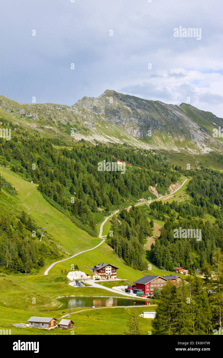 Hotels and guest houses in austrian Alps in summer Stock Photo - Alamy