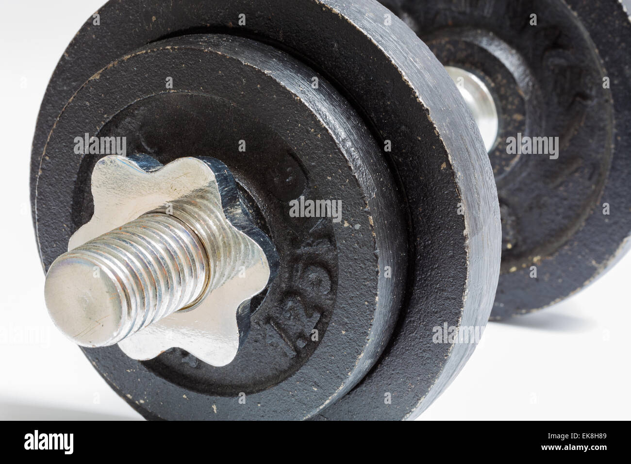 Dumbbell with two weights isolated as Cut Stock Photo - Alamy