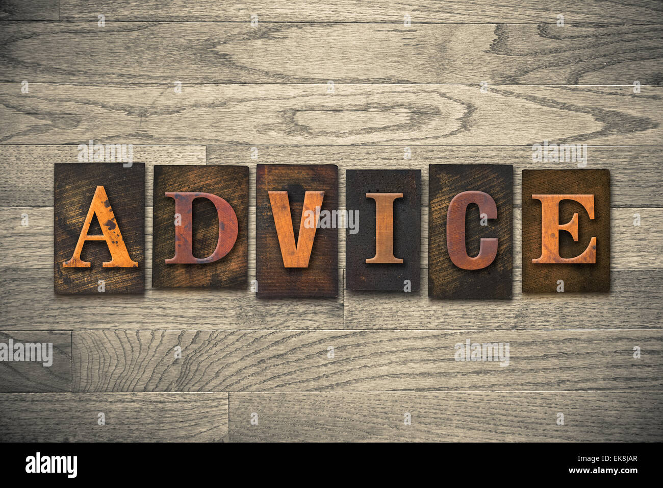 The word "ADVICE" theme written in vintage, ink stained, wooden ...