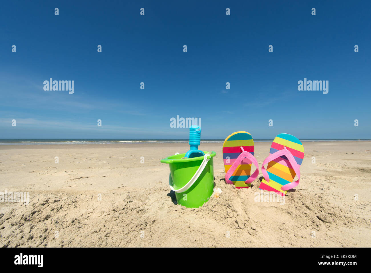 Summer beach with toys and flip flops Stock Photo - Alamy
