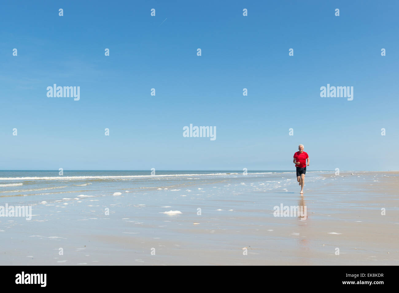 Senior runner at the beach Stock Photo - Alamy