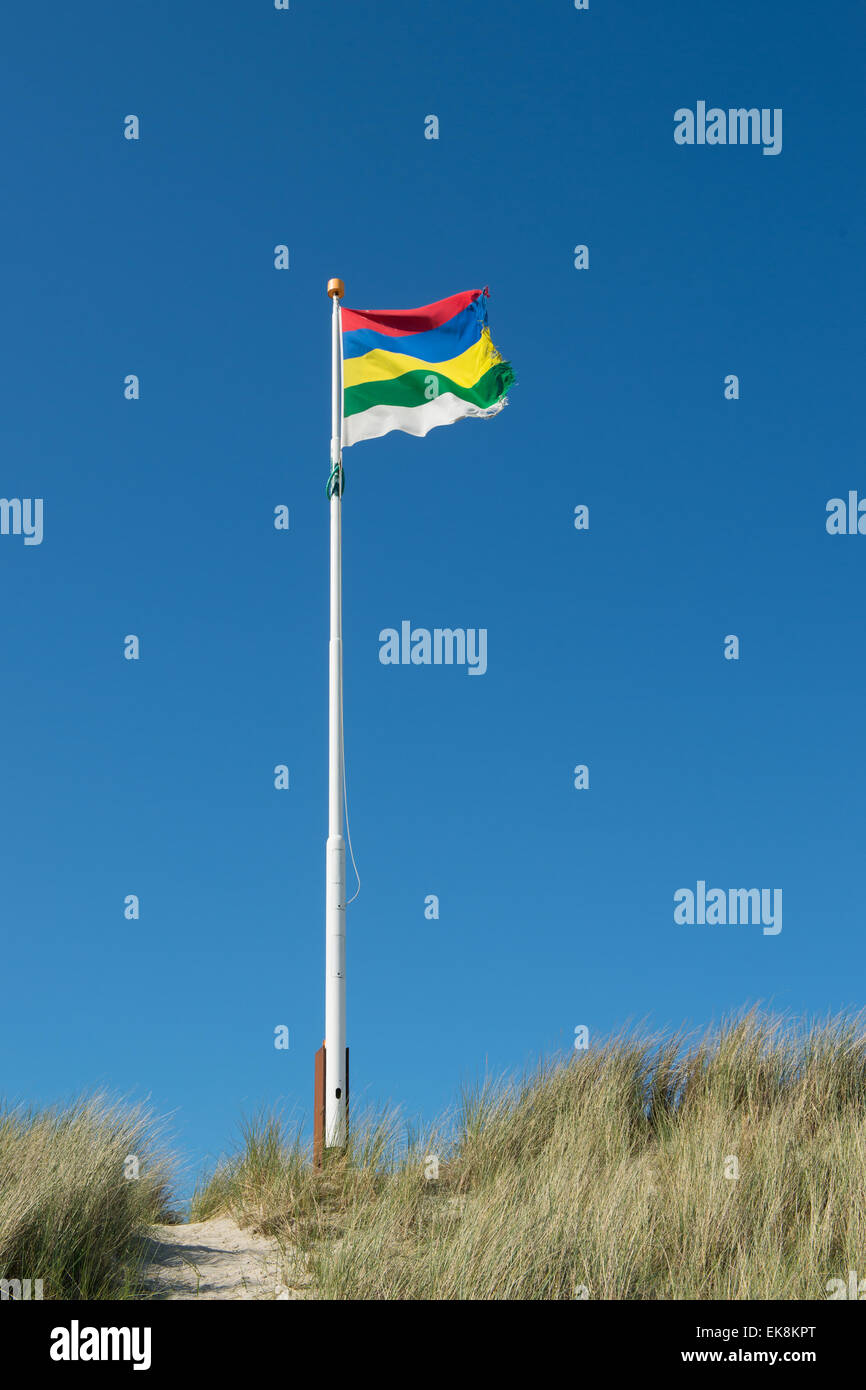 Flag in the wind on Dutch wadden island Terschelling Stock Photo - Alamy
