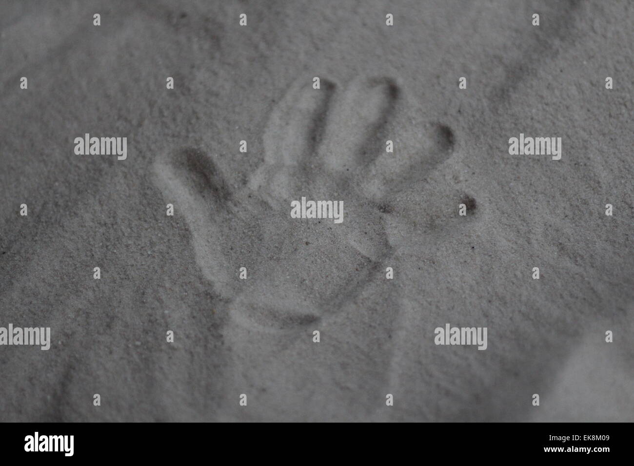 Hand print in the sand Stock Photo - Alamy