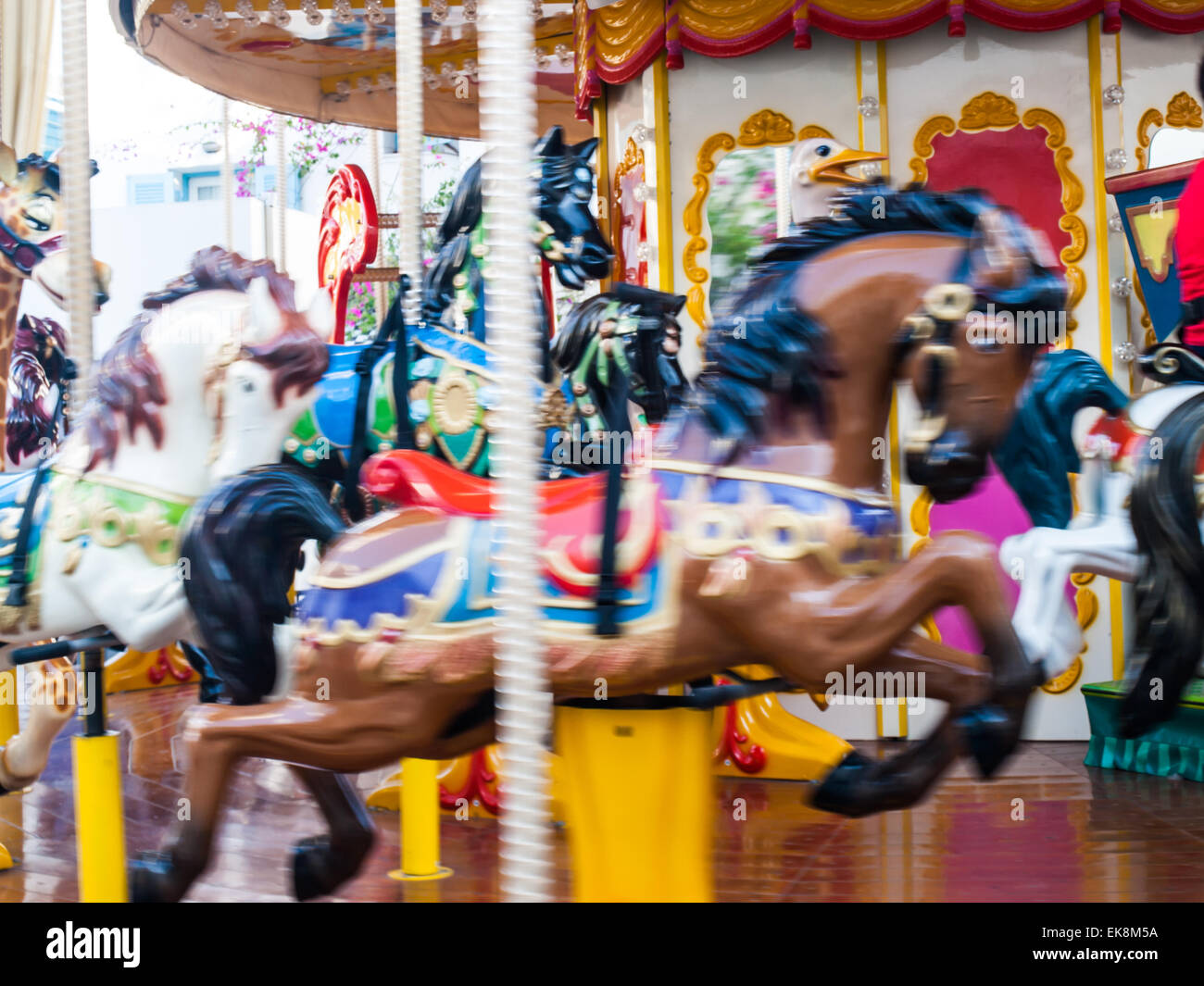Moving Carousel Horses, blur Stock Photo - Alamy