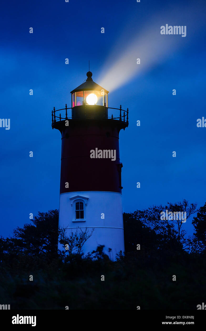 Nauset Light shines during a stormy night, Cape Cod National Seashore ...