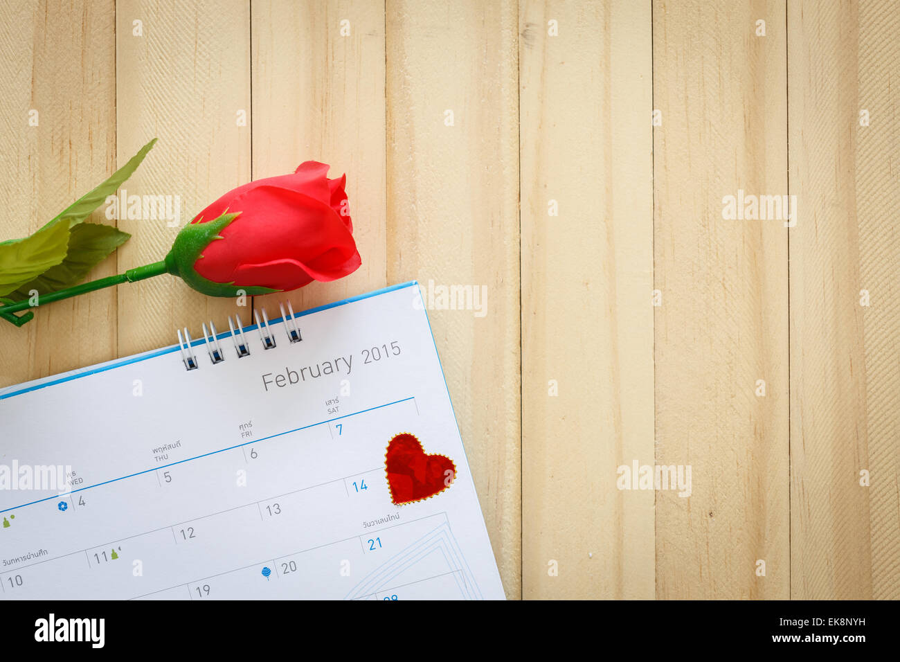 Close up Rose and calendar on wooden floor Stock Photo - Alamy