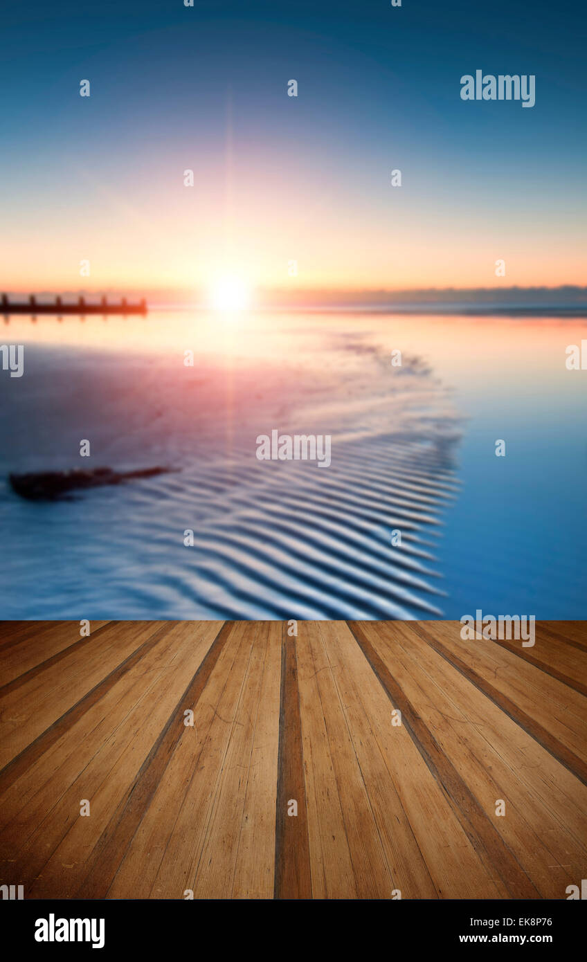 Beautiful low point of view along beach at low tide out to sea with ...
