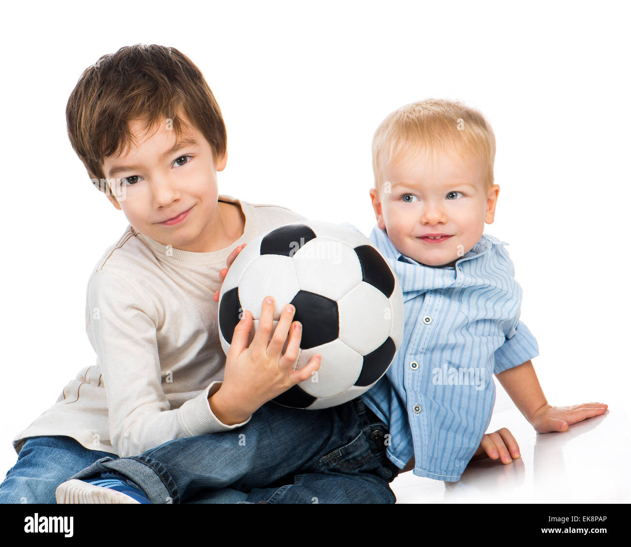 brothers with a soccer ball Stock Photo - Alamy