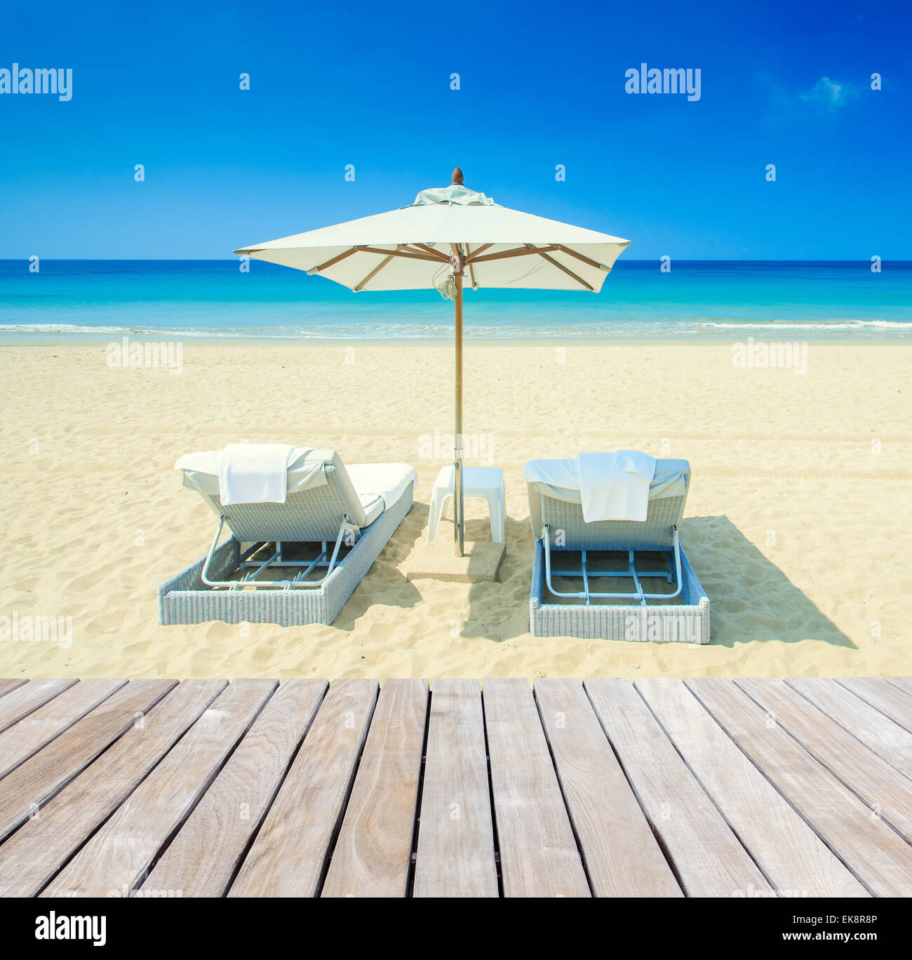 Grey wood decking and tropical beach Stock Photo - Alamy