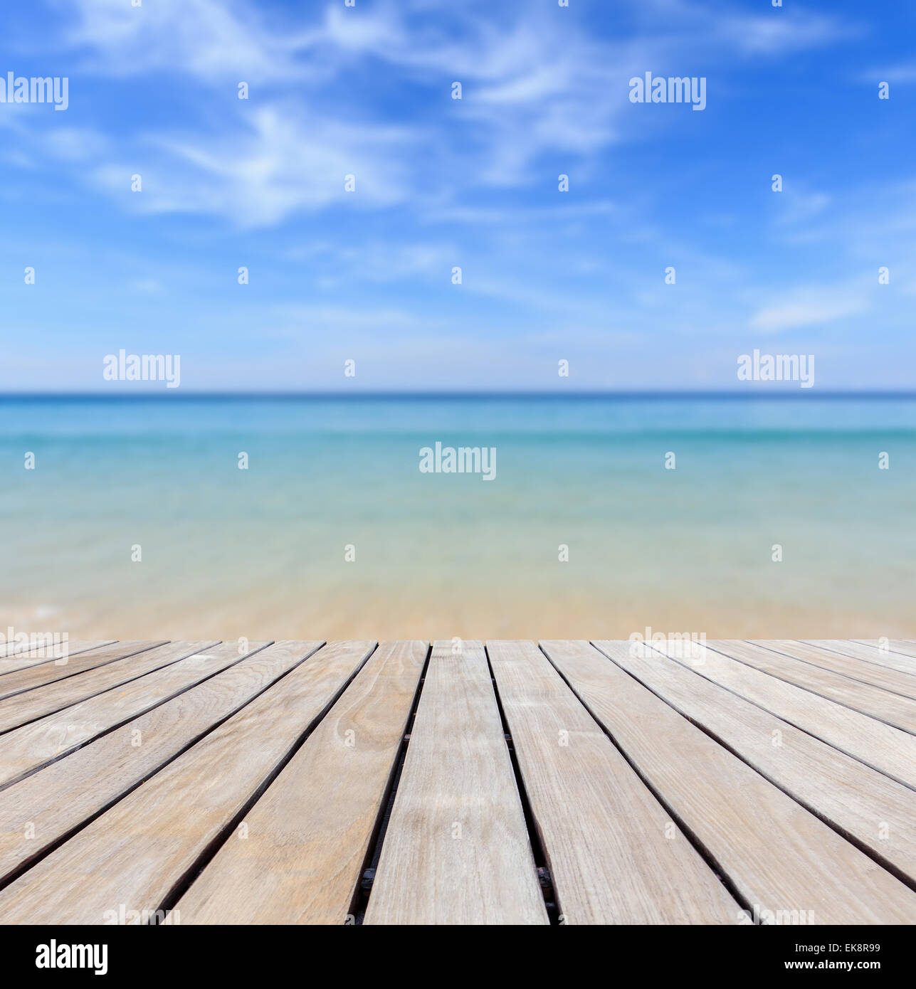 Grey wood decking and tropical beach Stock Photo - Alamy