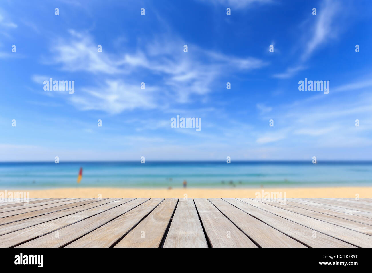 Grey wood decking and tropical beach Stock Photo - Alamy