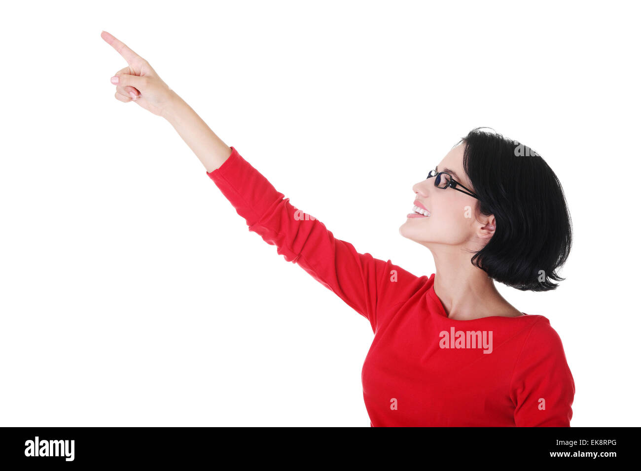 Excited young woman pointing on copy space Stock Photo - Alamy