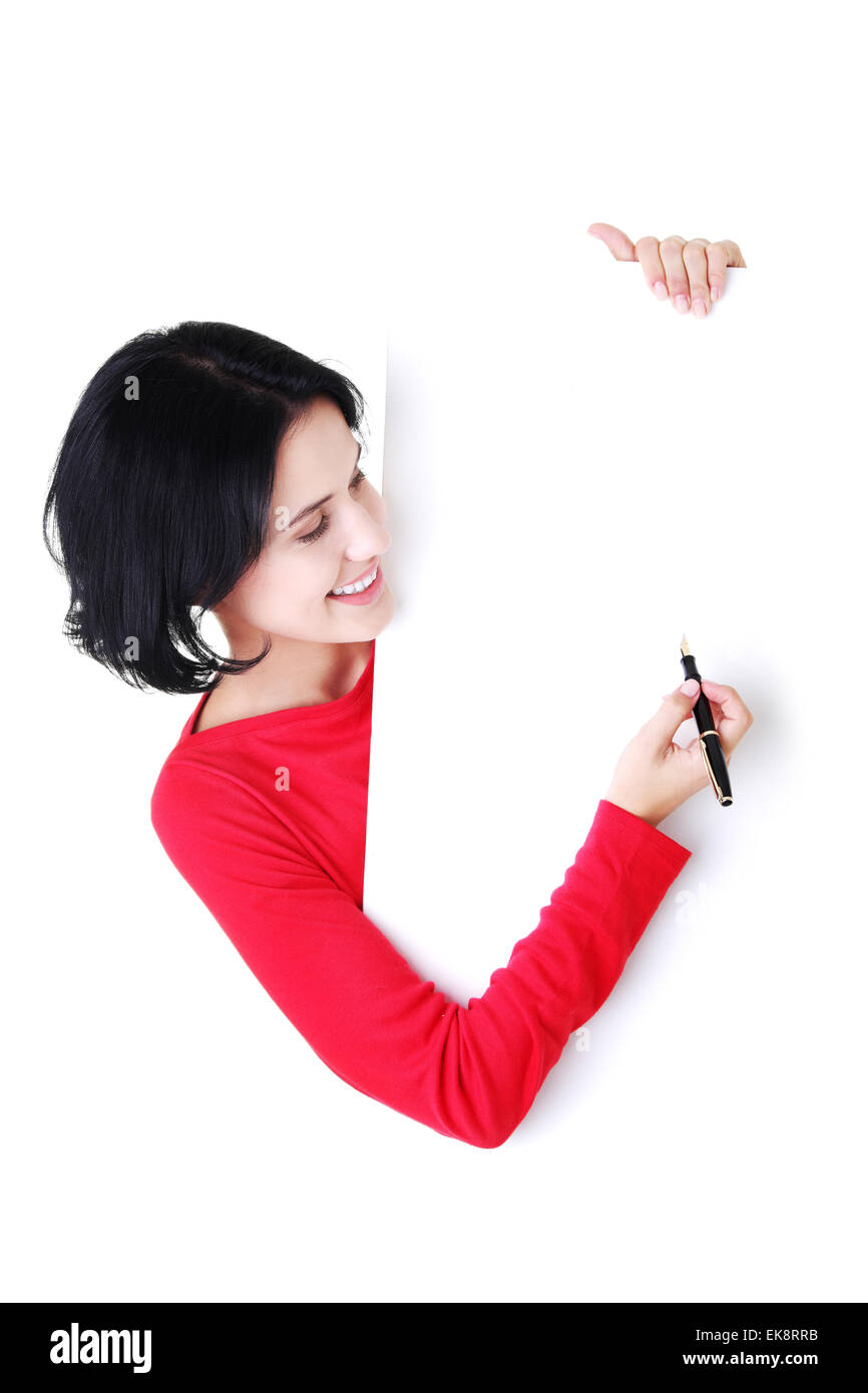 Happy beautiful woman writing with a pen on blank board Stock Photo - Alamy