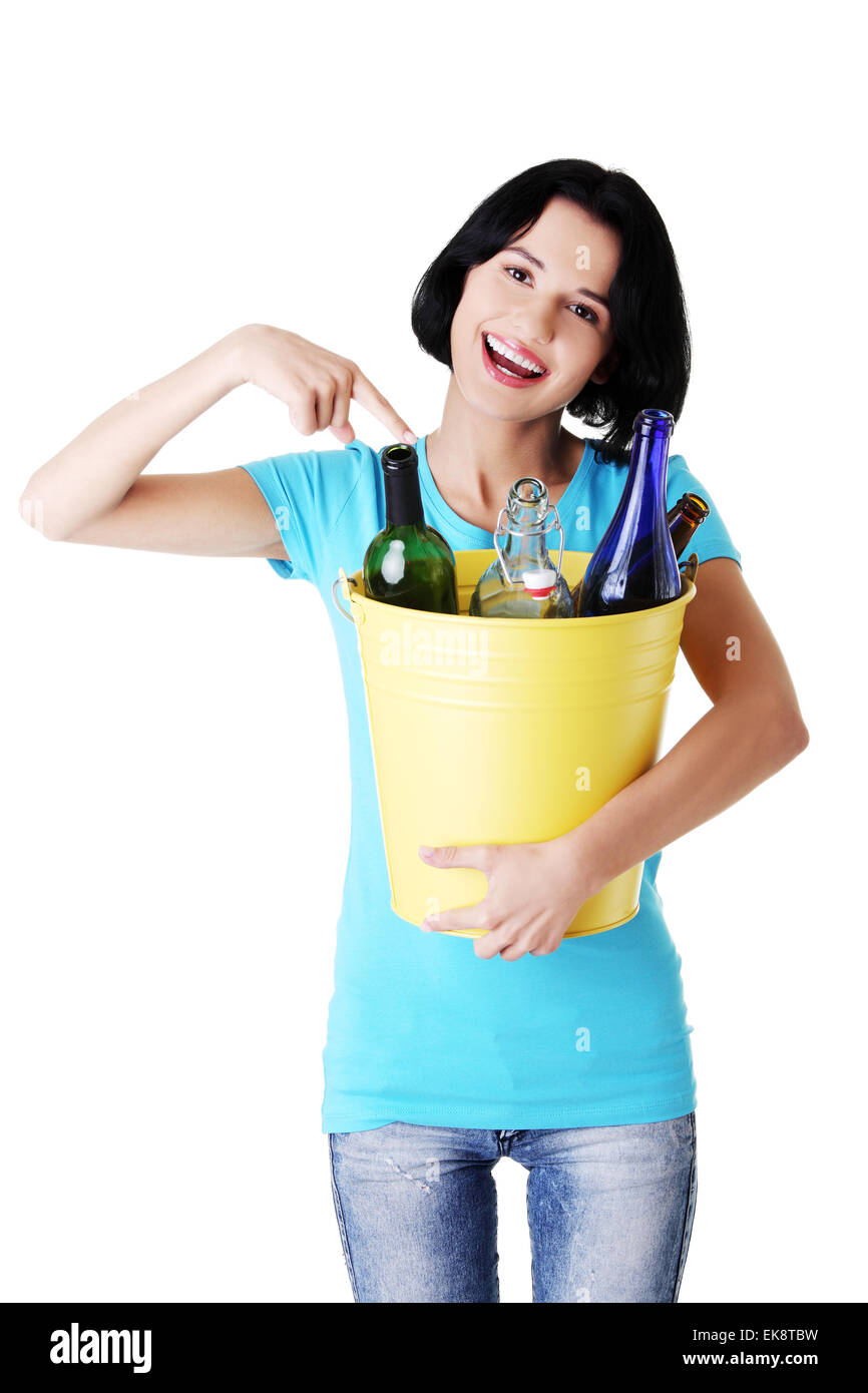 Beautiful young woman holding recycling bin Stock Photo - Alamy