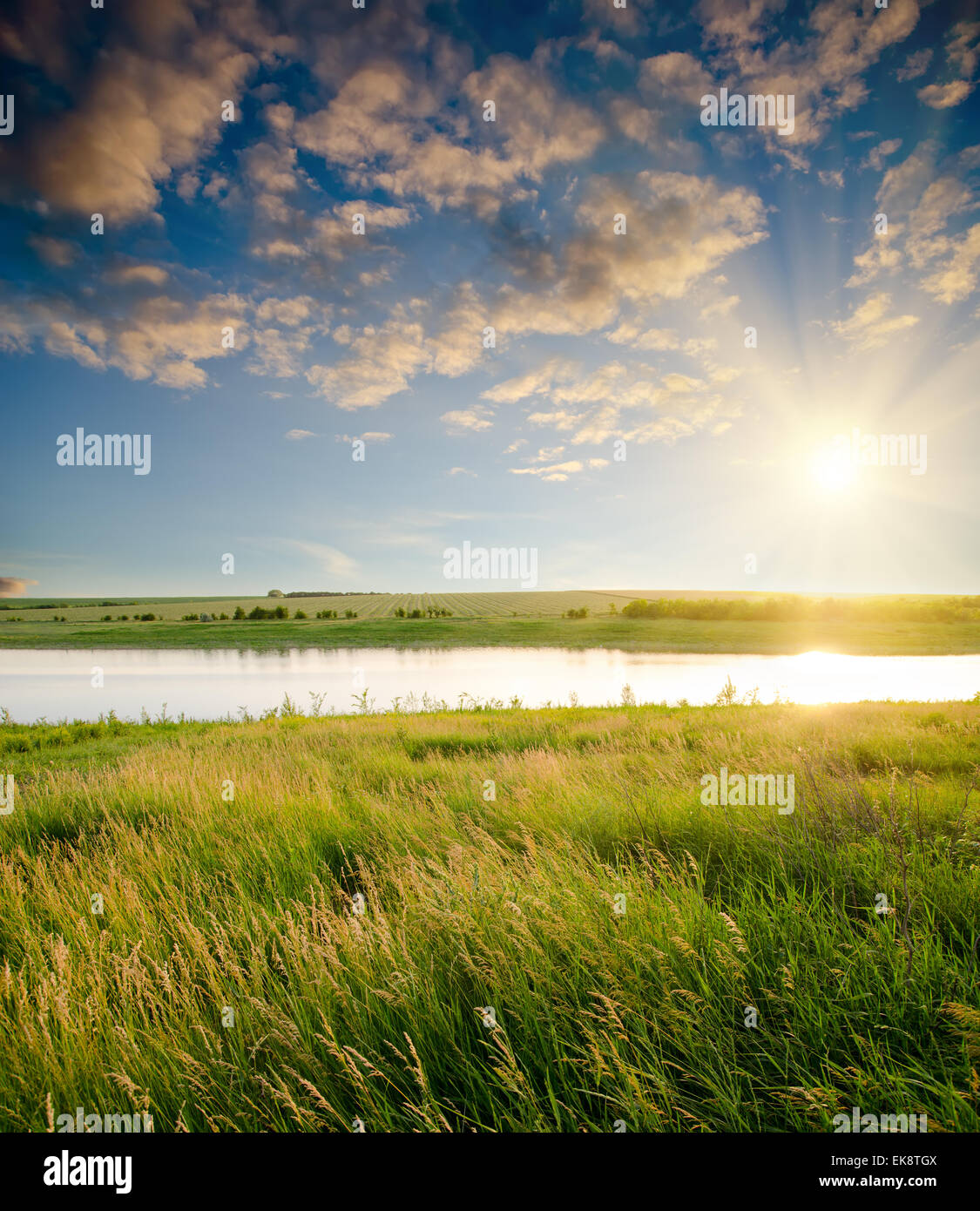 sunset over river Stock Photo - Alamy