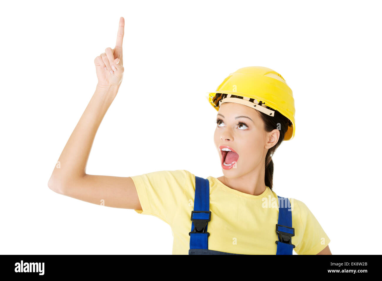 Female construction worker pointing on copy space Stock Photo - Alamy
