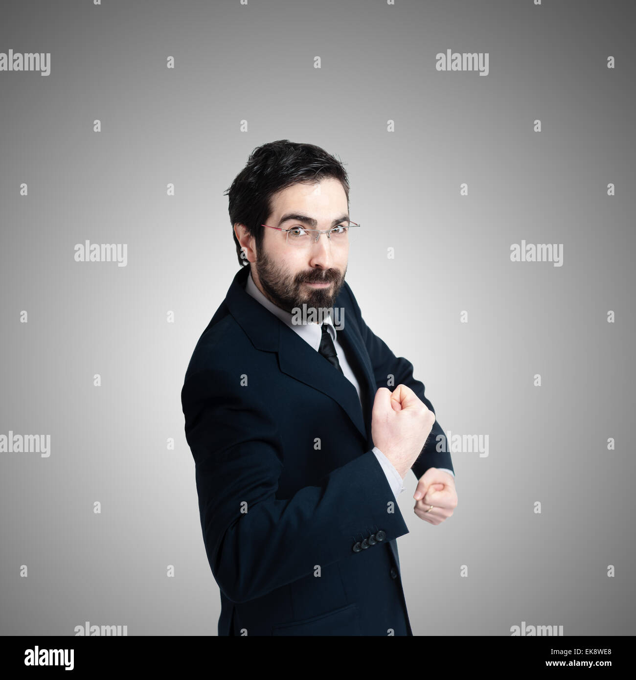 strong business man flexing muscle Stock Photo - Alamy