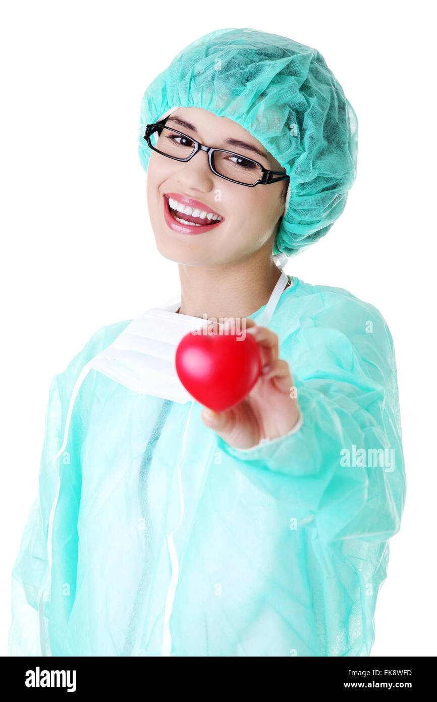 Smiling female doctor or nurse holding heart Stock Photo - Alamy Smiling female doctor or nurse holding heart Stock Photo - Alamy