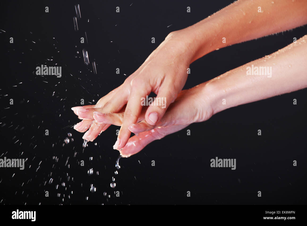 Water falling over hand hi-res stock photography and images - Alamy