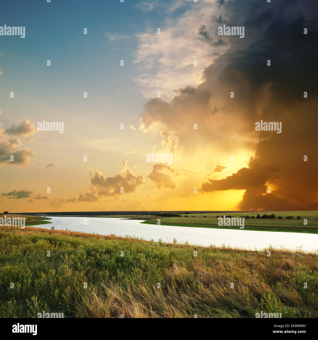 Golden sunset over river Stock Photo - Alamy