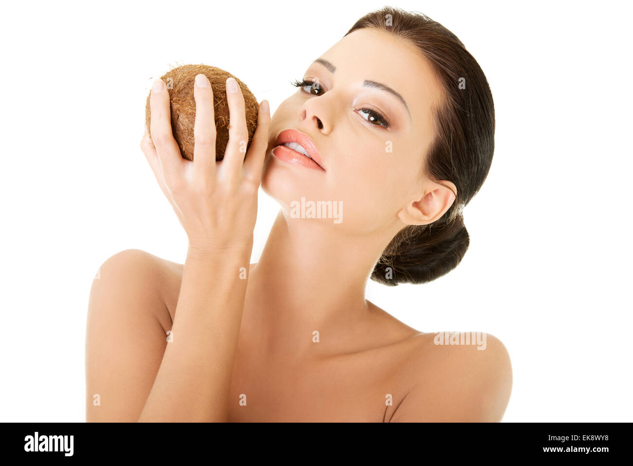 Beautiful woman with coconut in hands Stock Photo - Alamy
