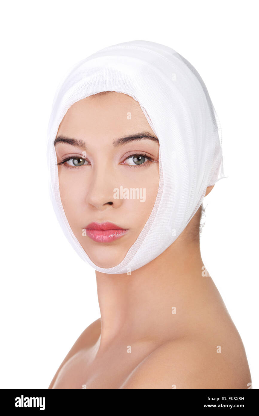 Beautiful young female face with bandage Stock Photo - Alamy