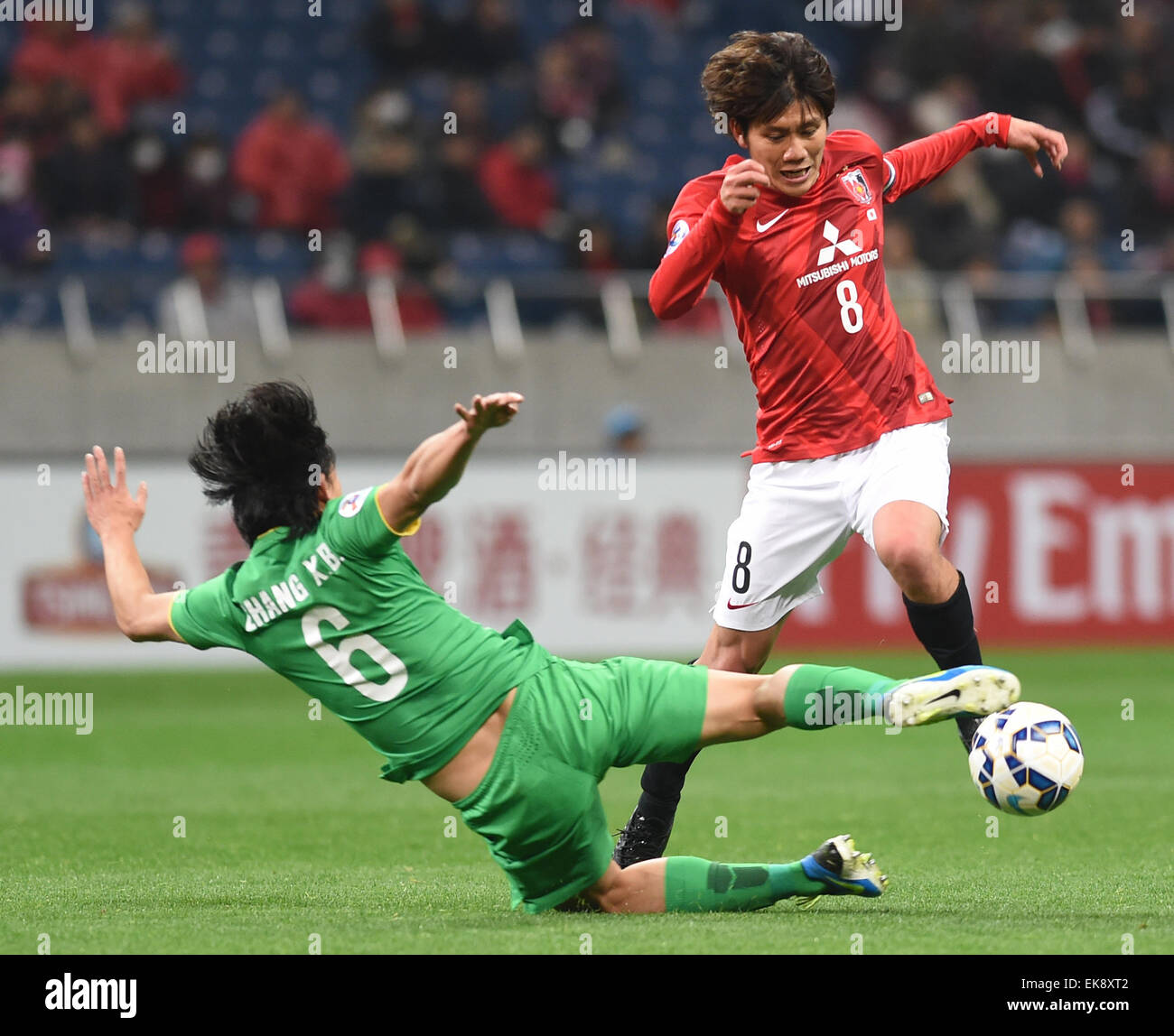 Saitama, Japan. 8th Apr, 2015. Yosuke Kashiwagi (R) of Japan's Urawa Red Diamonds vies with ...