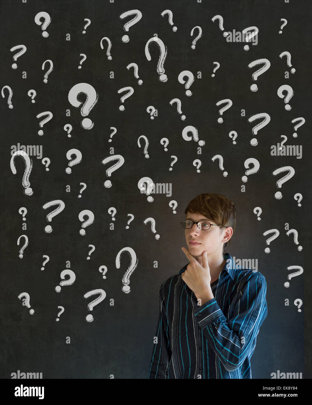 Thinking business man with chalk question marks Stock Photo - Alamy