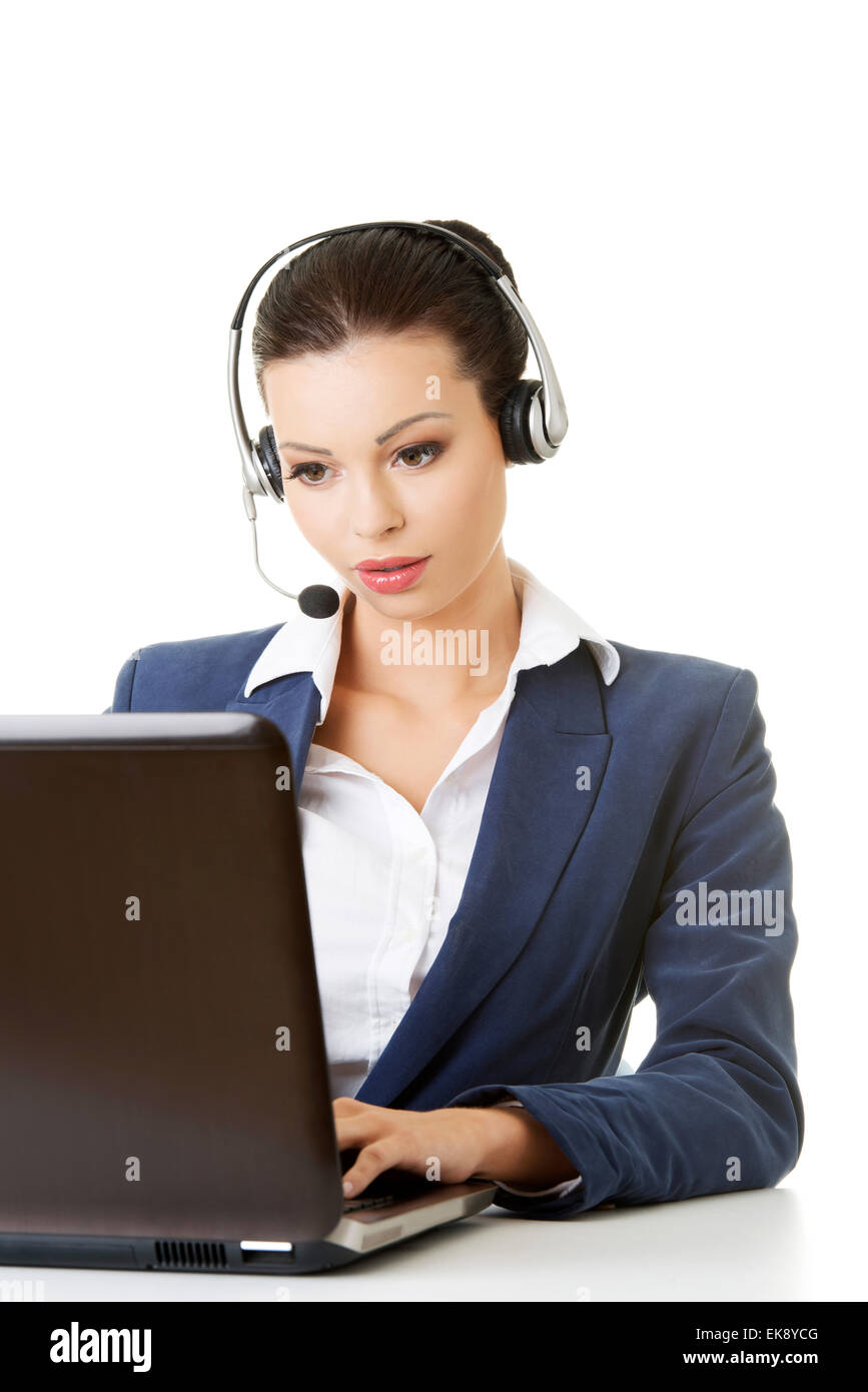 Beautiful young call-center assistant at the desk Stock Photo - Alamy