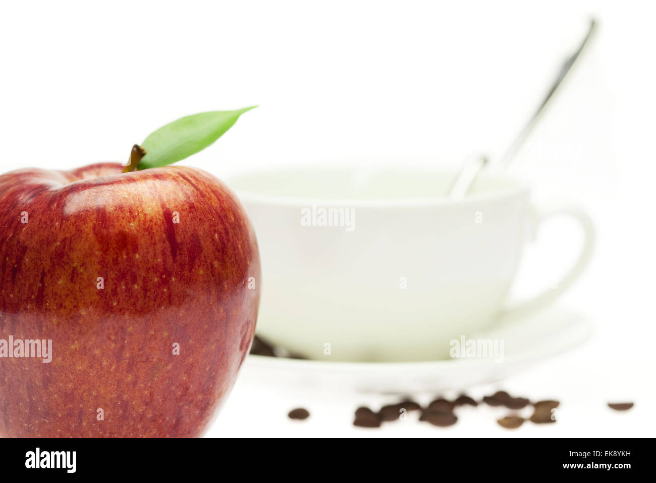 apple and a cup isolated on white Stock Photo - Alamy