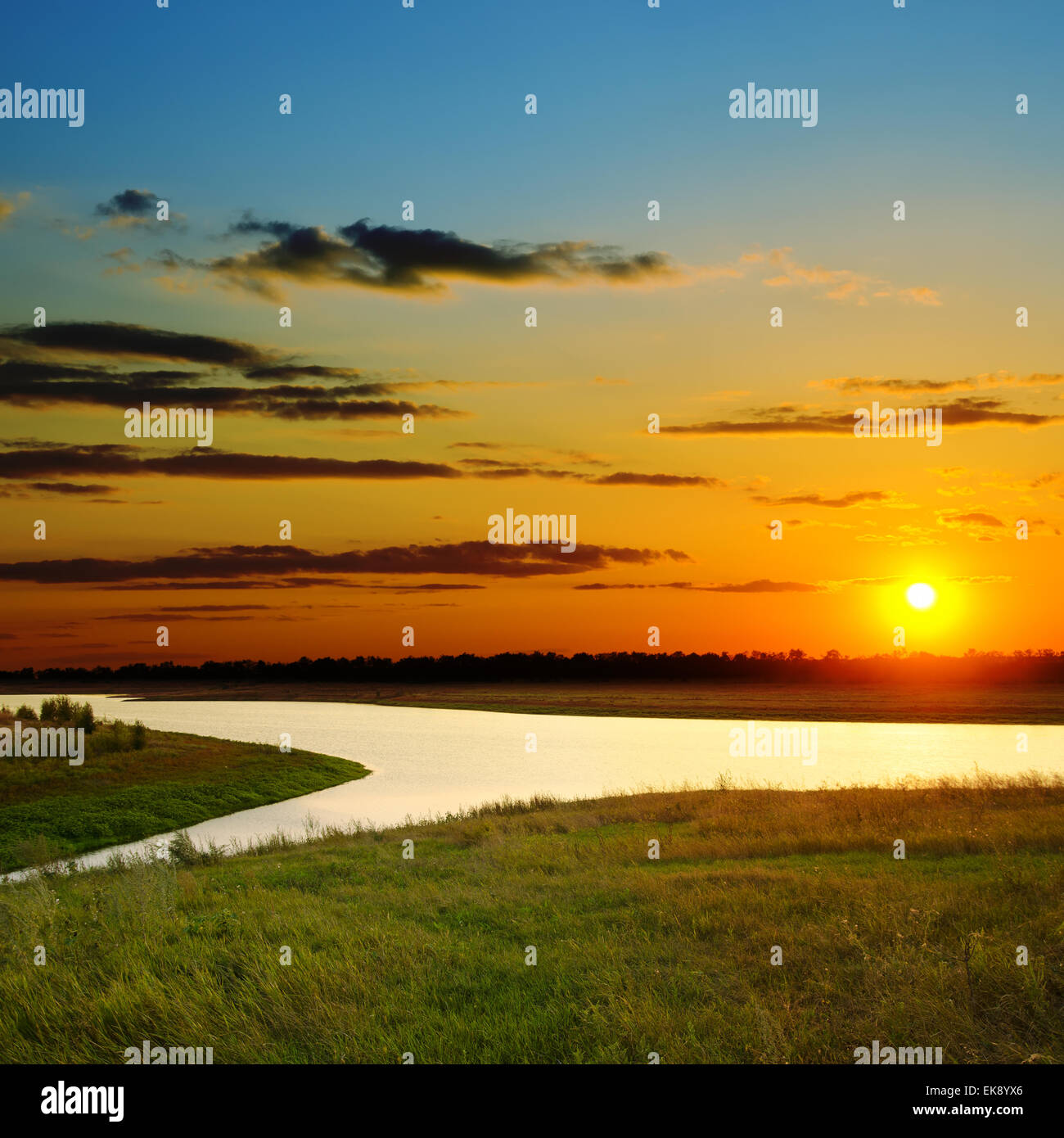 sunset over river Stock Photo - Alamy