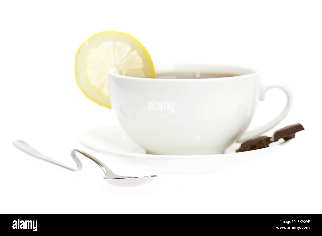 white cup, a spoon and a lemon isolated on white Stock Photo - Alamy
