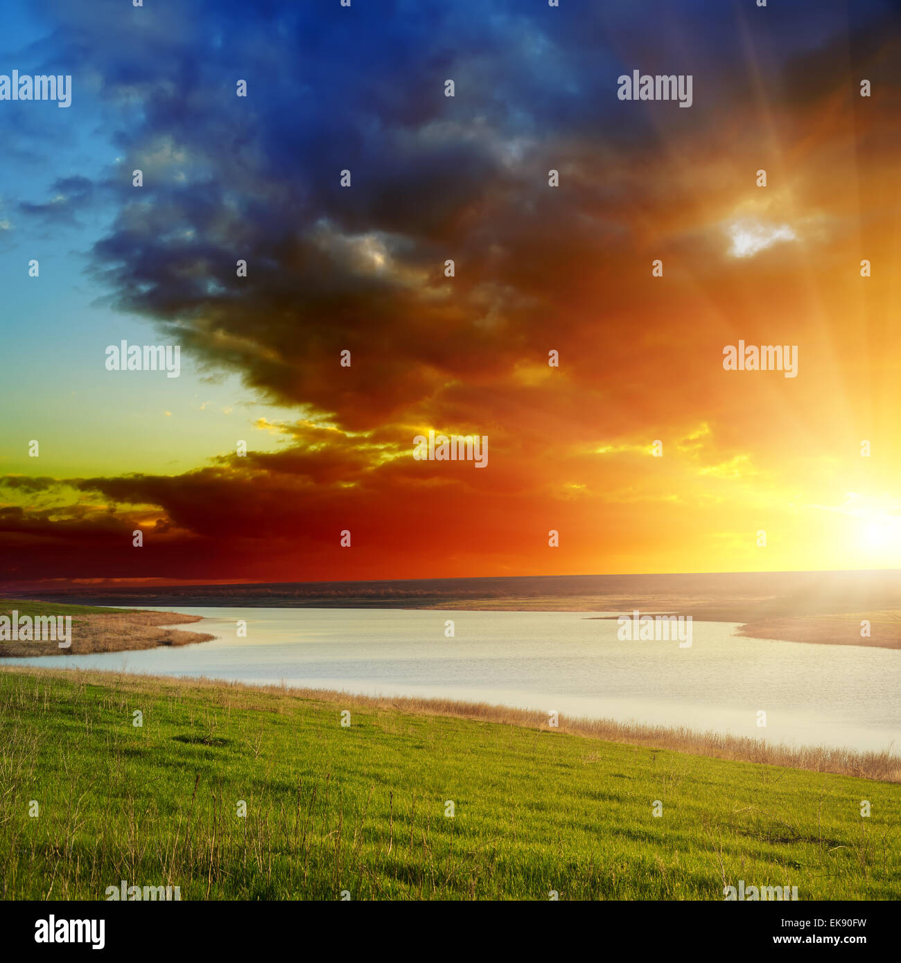 dramatic sunset over river Stock Photo - Alamy