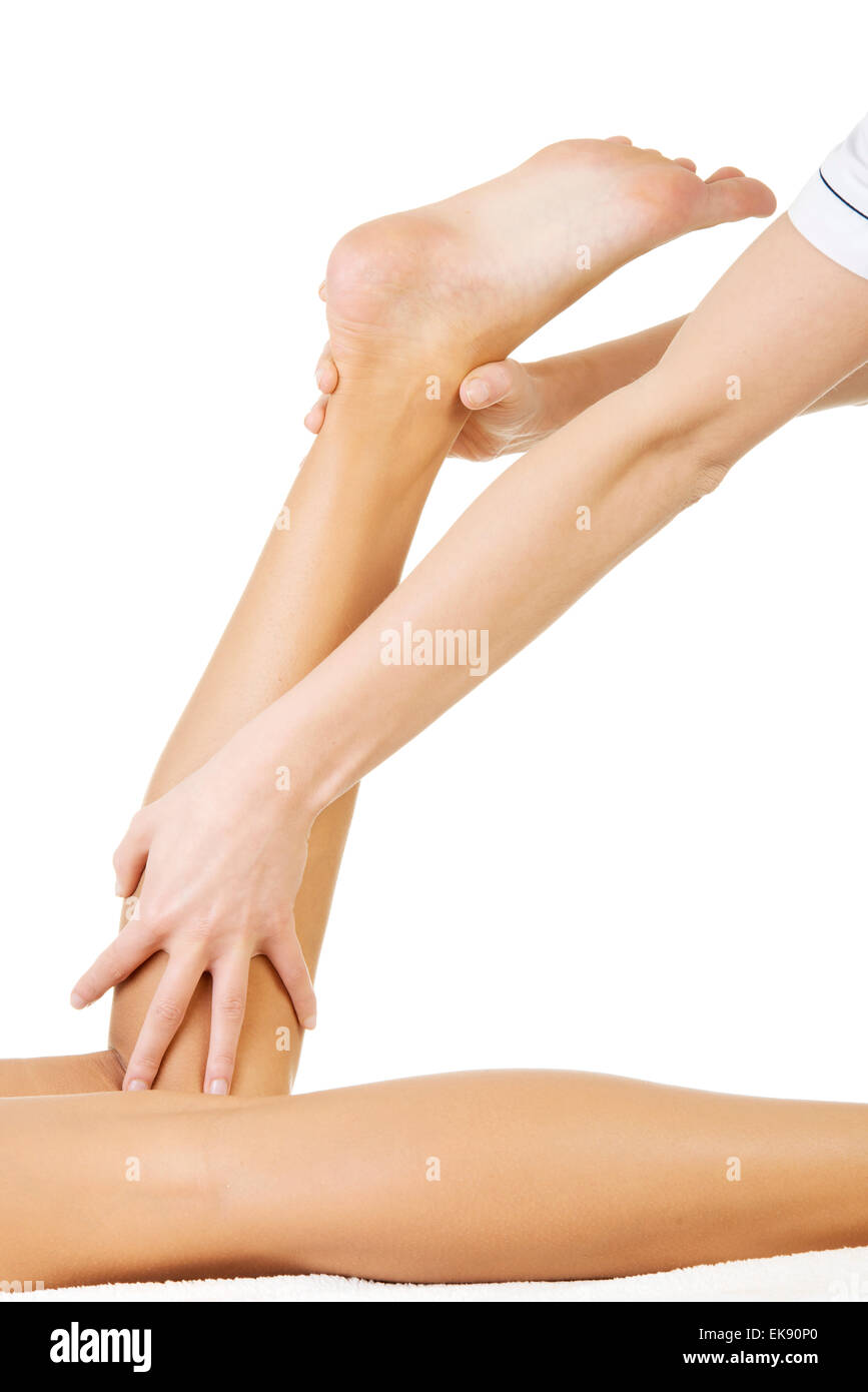 Physio therapist trying to fix the leg Stock Photo - Alamy