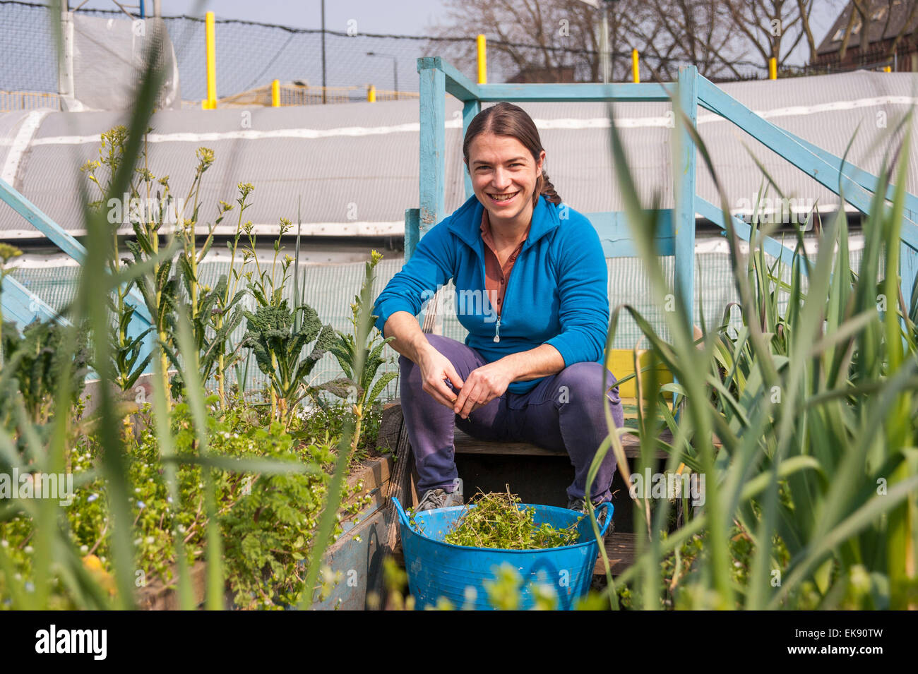 London, UK. 8th April, 2015. Volunteer, Kat Goodman, tends vegetables ...