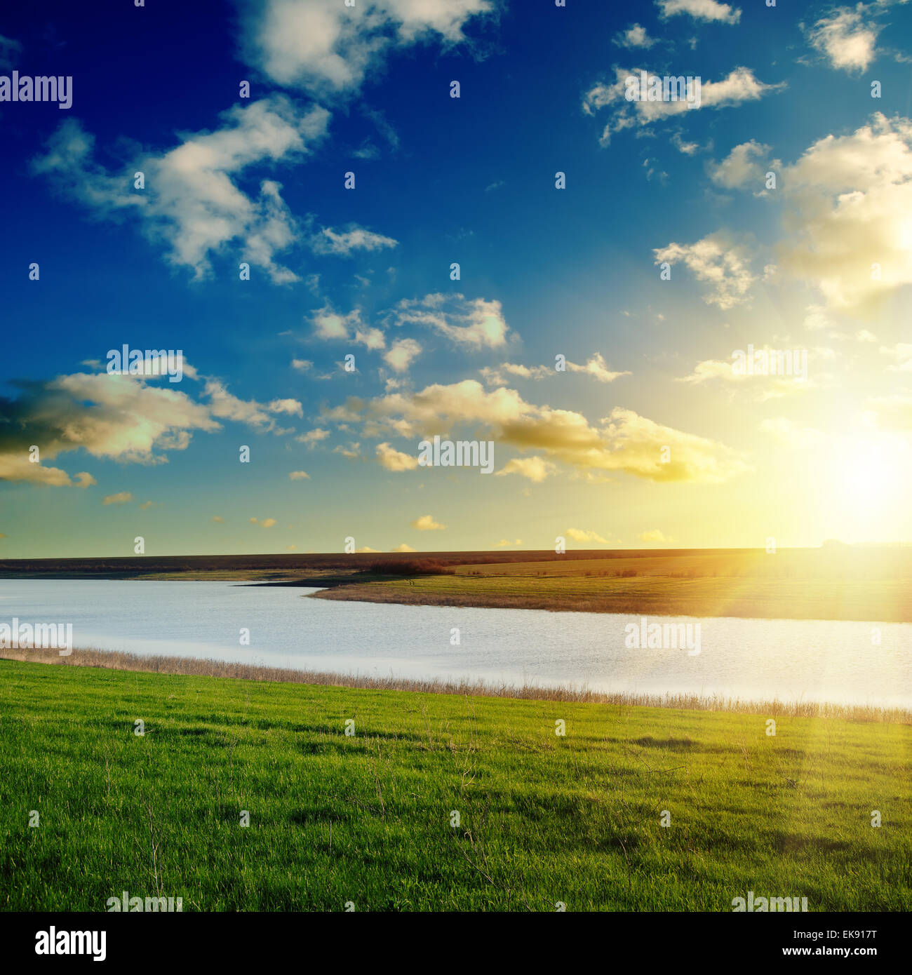 dramatic sunset over river Stock Photo - Alamy