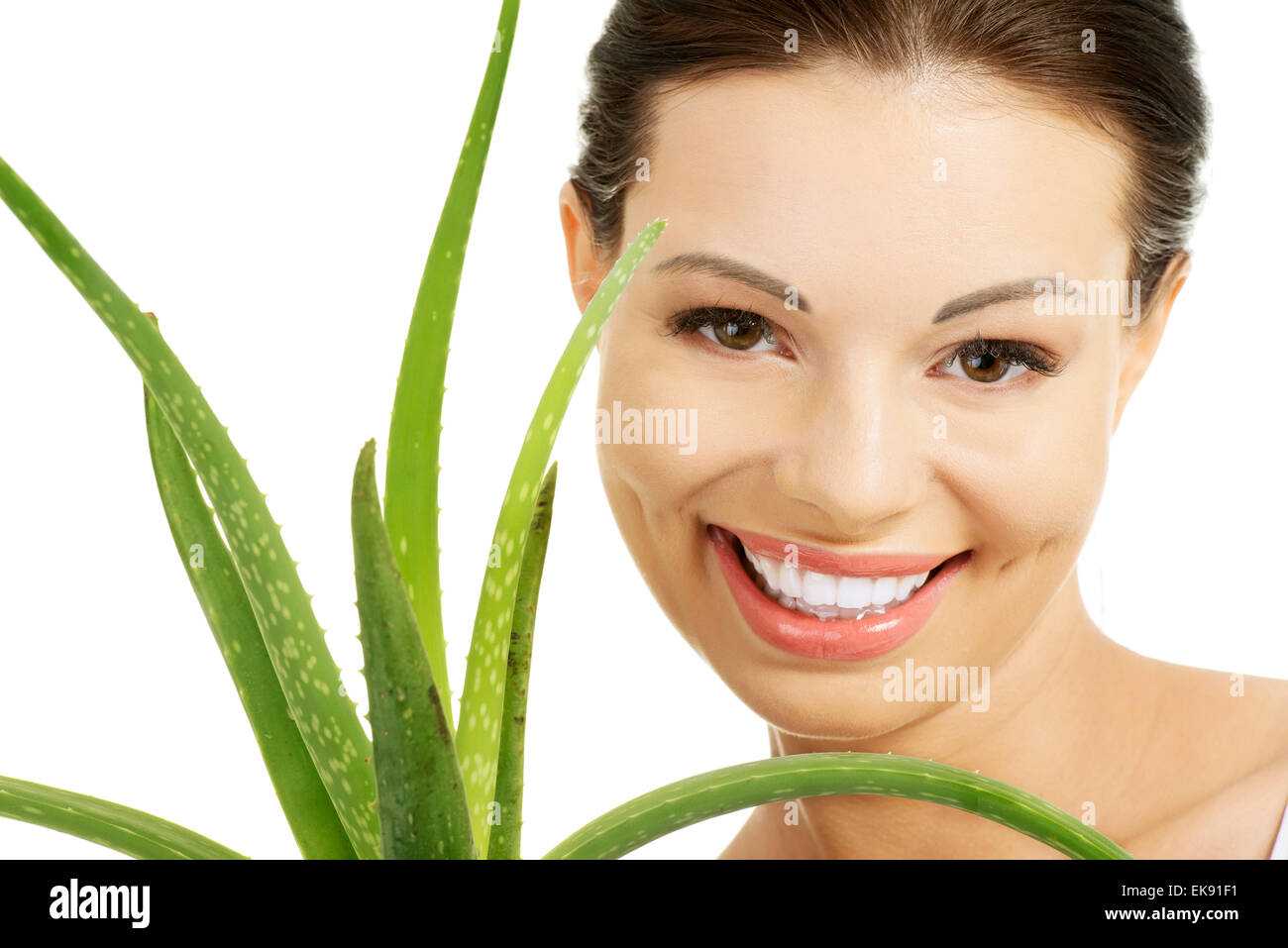 Young beautiful woman's face and aloe vera Stock Photo - Alamy