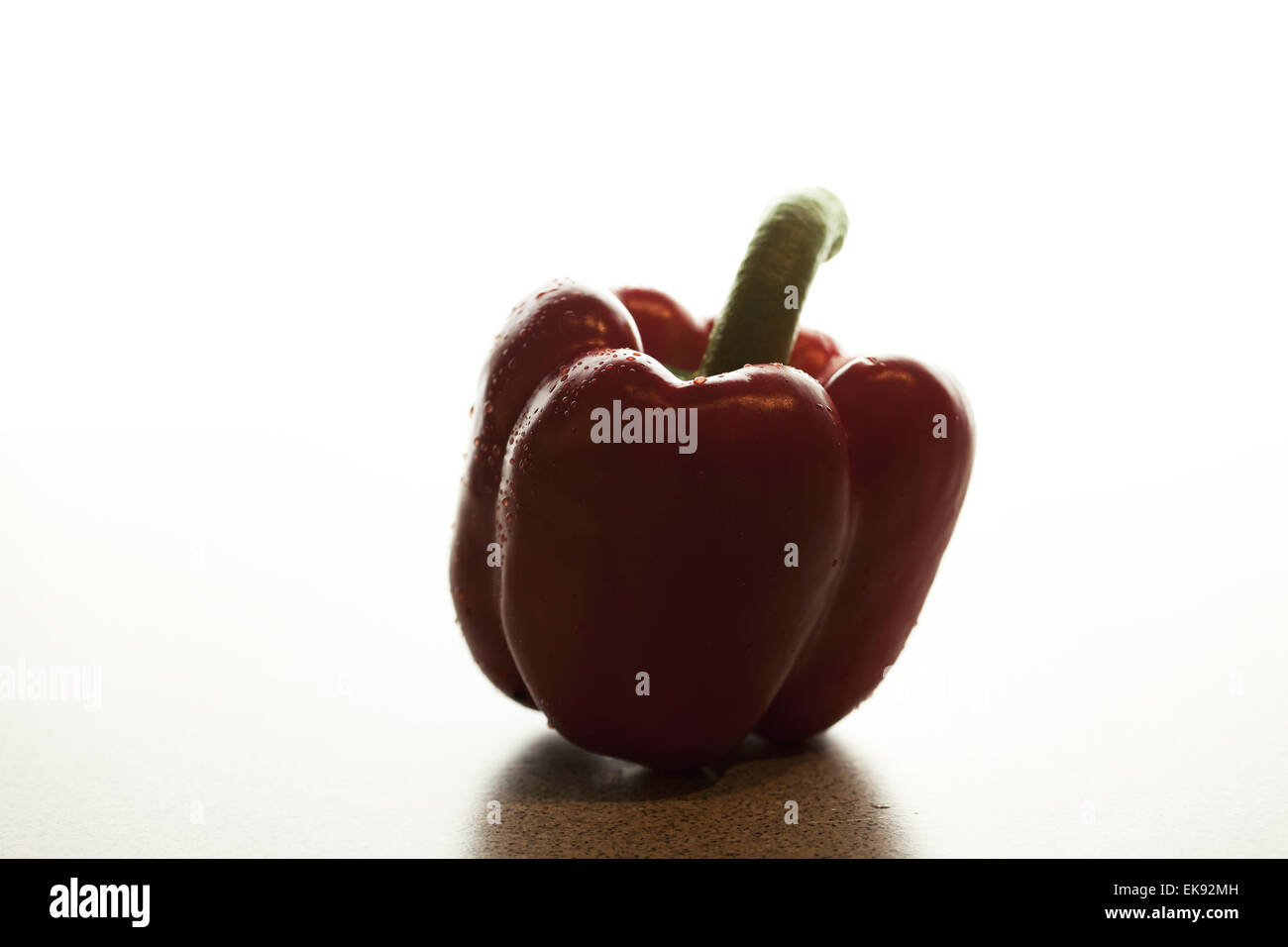 red peppers in the shadow isolated on white Stock Photo - Alamy