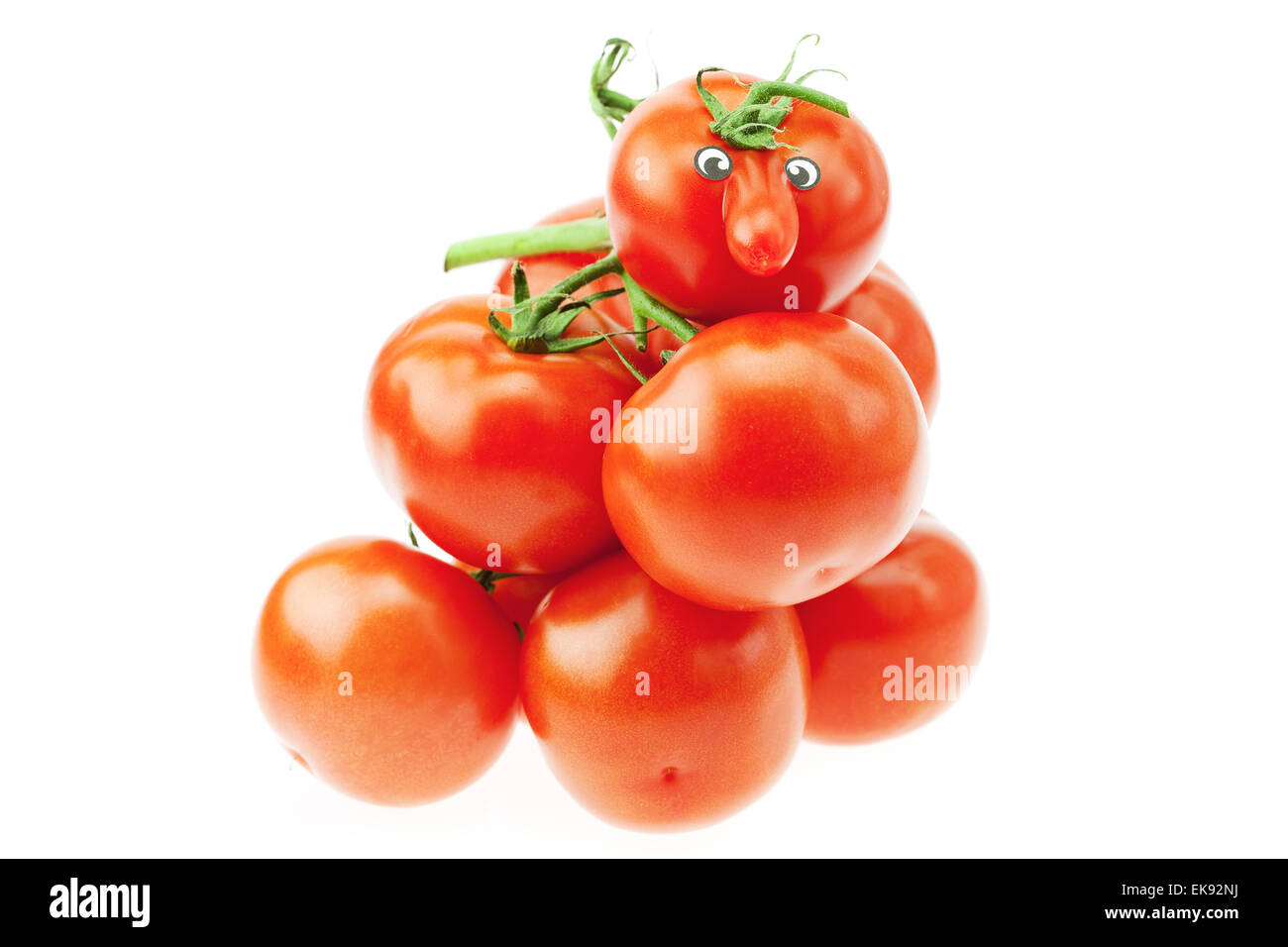 tomato with a nose and a bunch of tomatoes isolated on white Stock ...