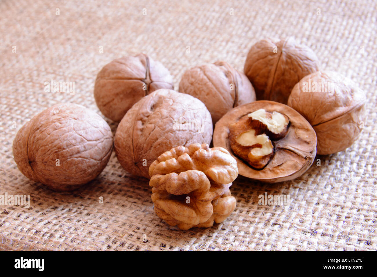 Mature walnuts on woven fabric Stock Photo - Alamy