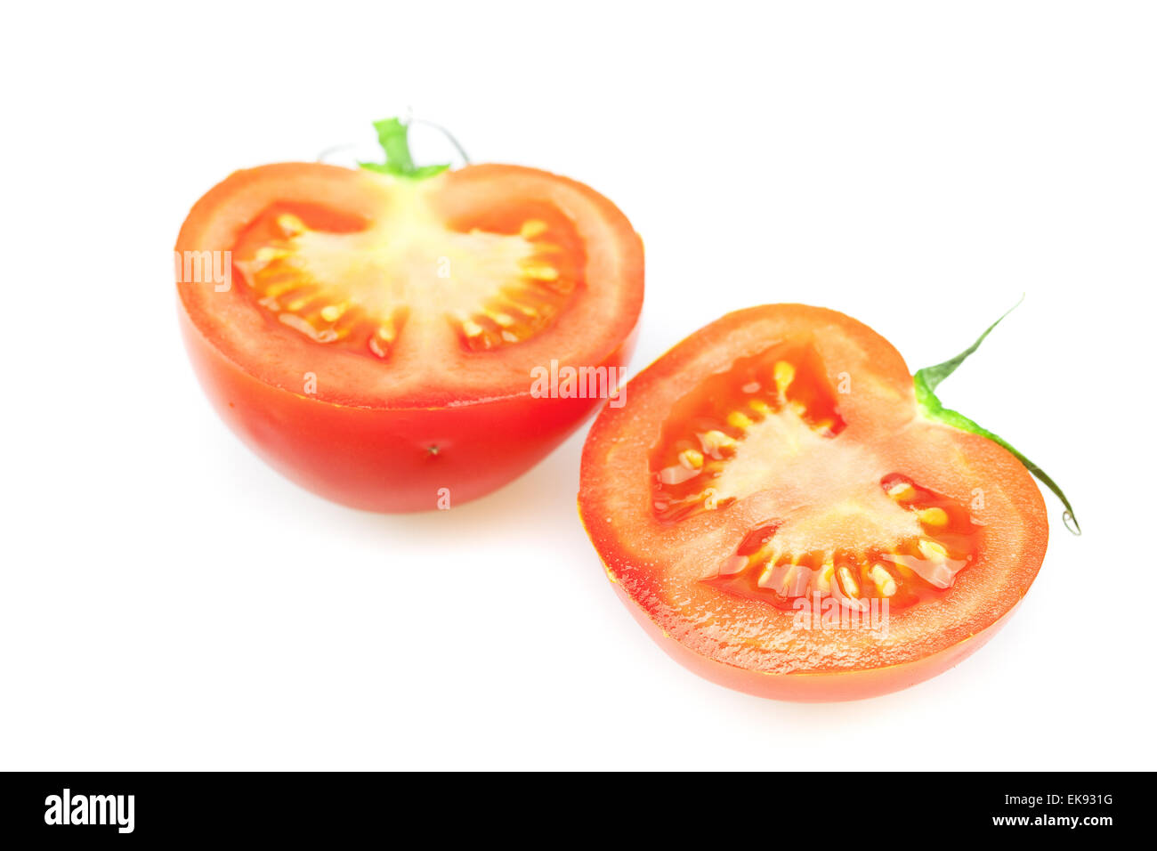 two halves of tomato isolated on white Stock Photo - Alamy