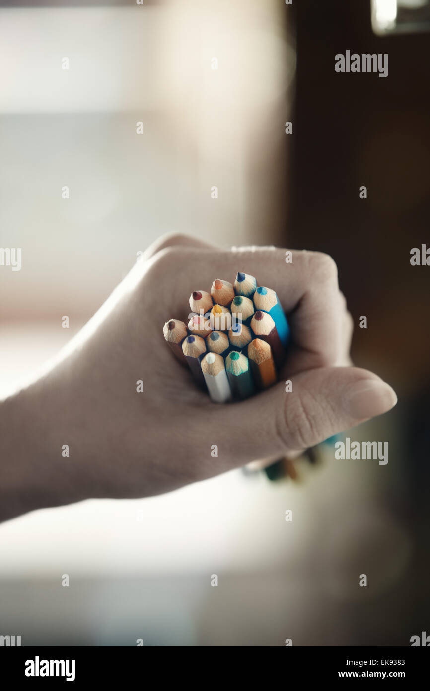 Hand with pencils Stock Photo - Alamy