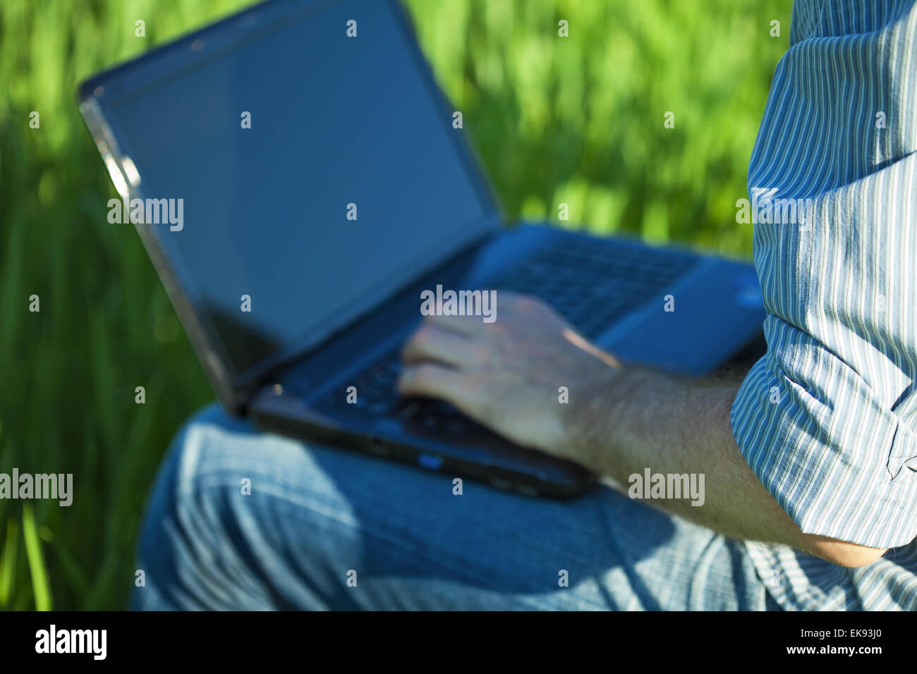 Man working behind laptop hi-res stock photography and images - Alamy