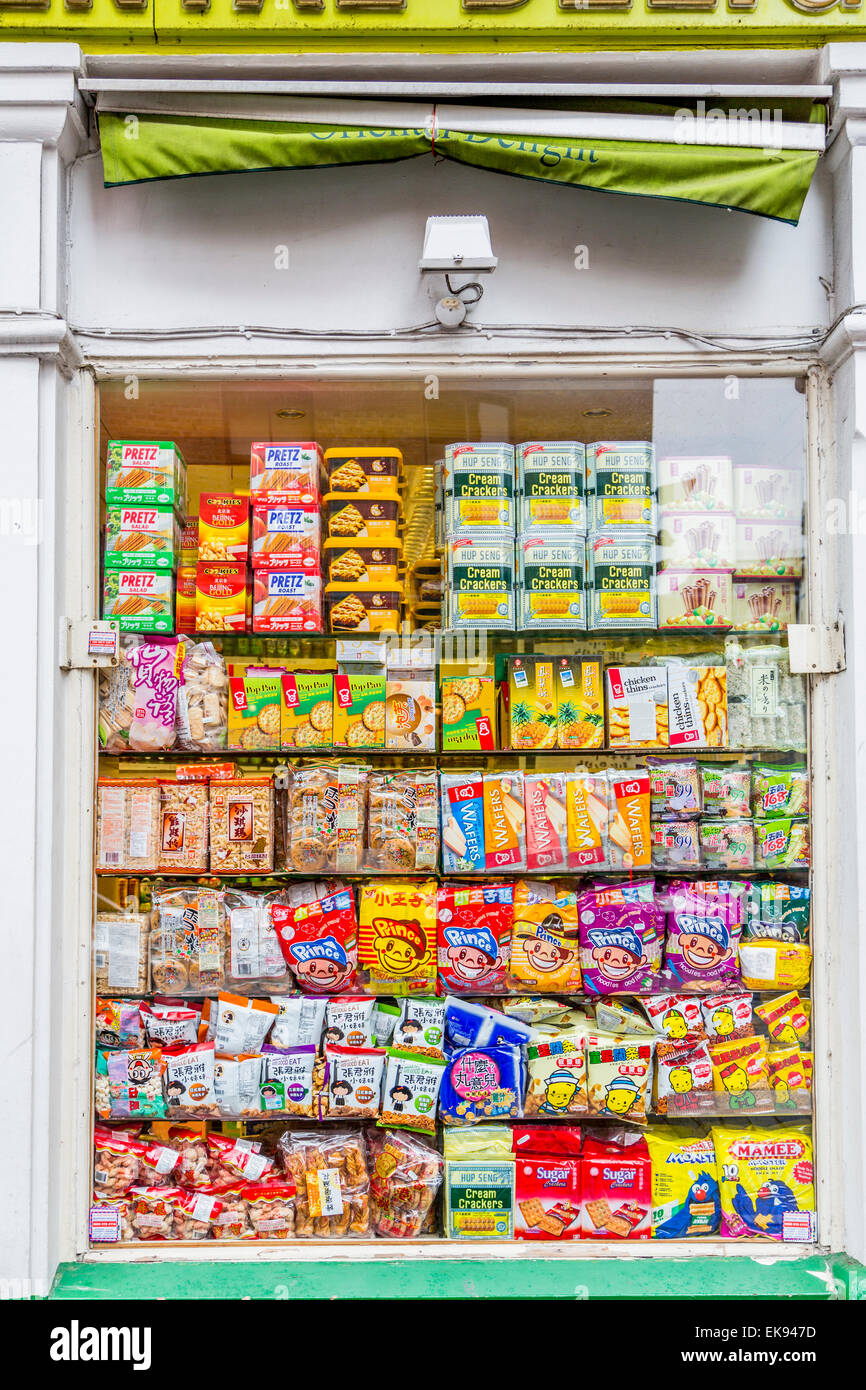 A Colorful Chinese supermarket store window front stocked with produce ...